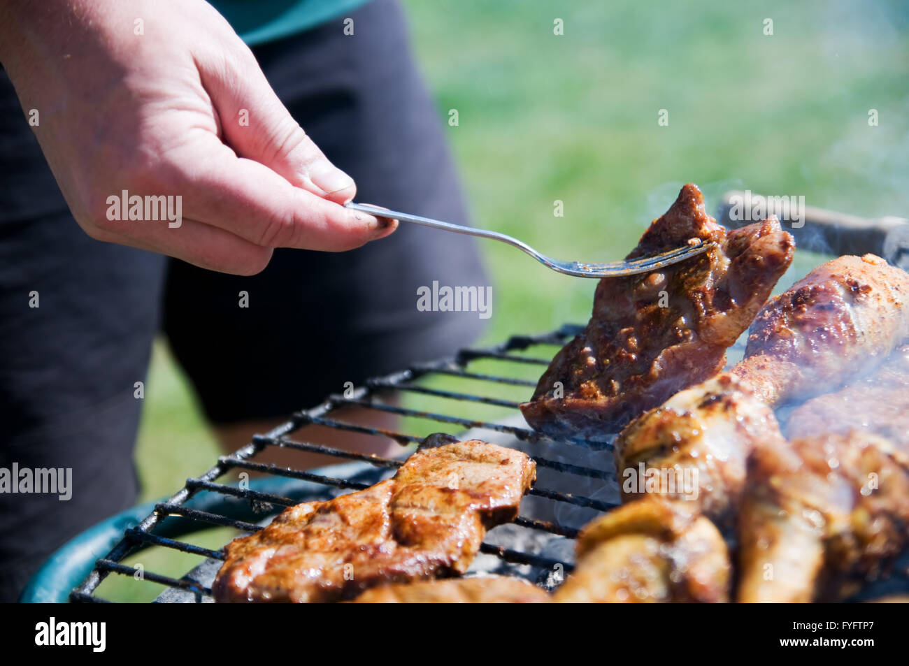 Cooking on the barbecue grill Stock Photo - Alamy