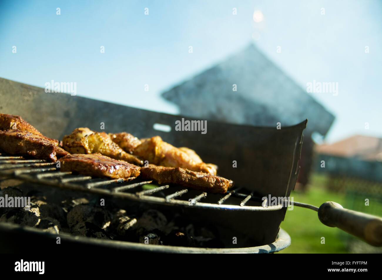 Cooking on the barbecue grill Stock Photo - Alamy