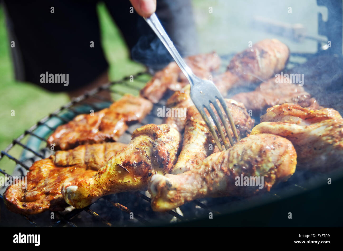 Cooking on the barbecue grill Stock Photo - Alamy