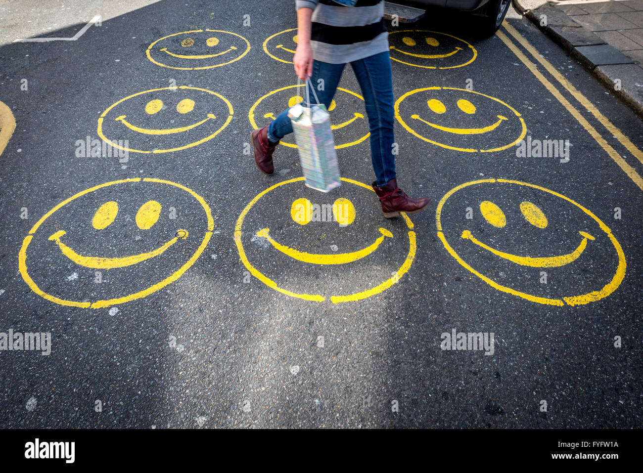 Smiley faces painted onto the road in Brighton Stock Photo - Alamy