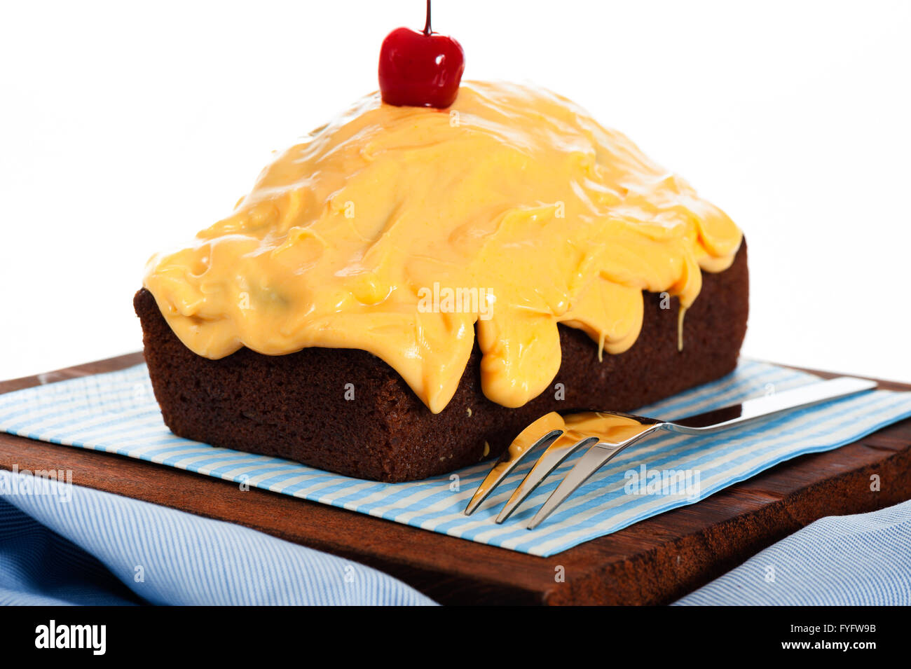 Cake with yellow icing Stock Photo - Alamy
