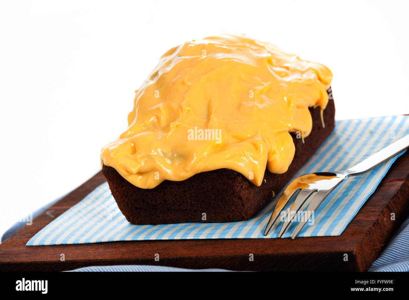 Cake with yellow icing Stock Photo - Alamy