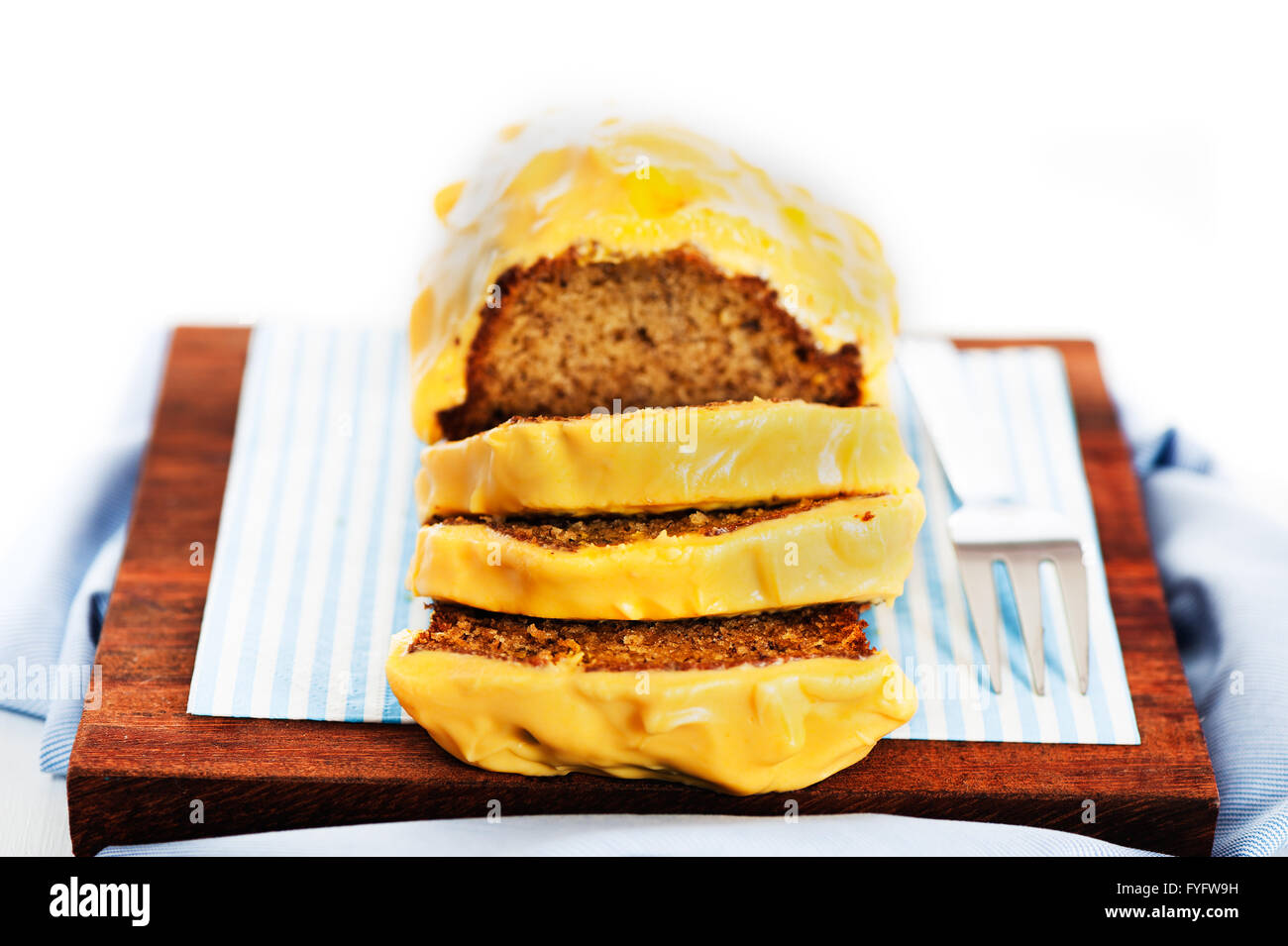 Cake with yellow icing Stock Photo - Alamy
