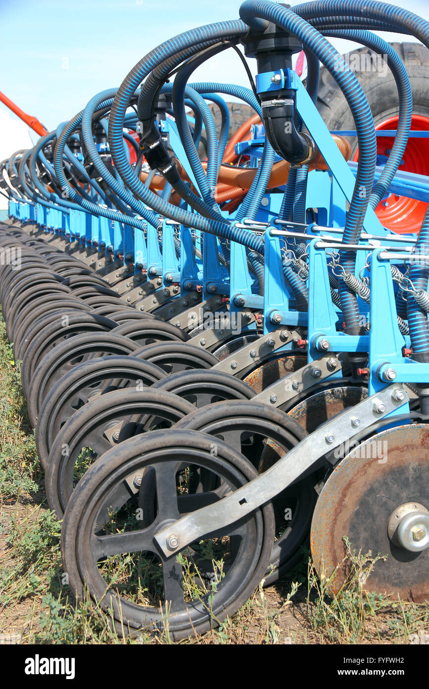 tractor and seeder planting crops on a field Stock Photo - Alamy