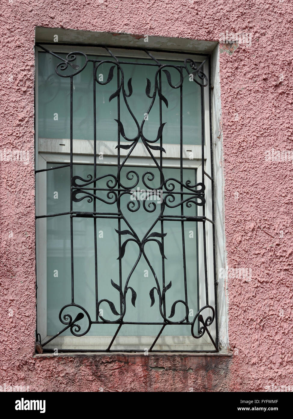 black metal forged carved lattice at a white window Stock Photo - Alamy