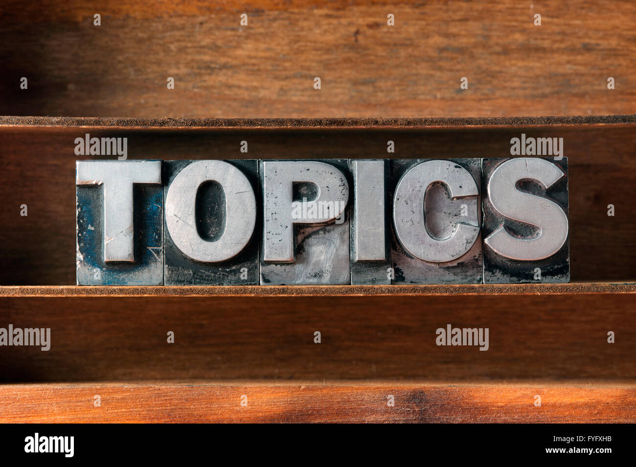 topics word made from metallic letterpress type on wooden tray Stock ...