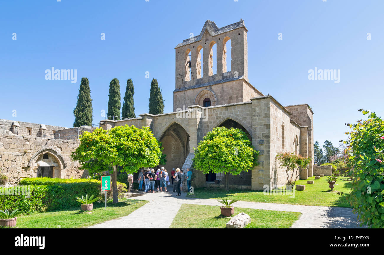 NORTH CYPRUS BELLAPAIS MONASTERY OR ABBEY WITH A GROUP OF TOURISTS ...