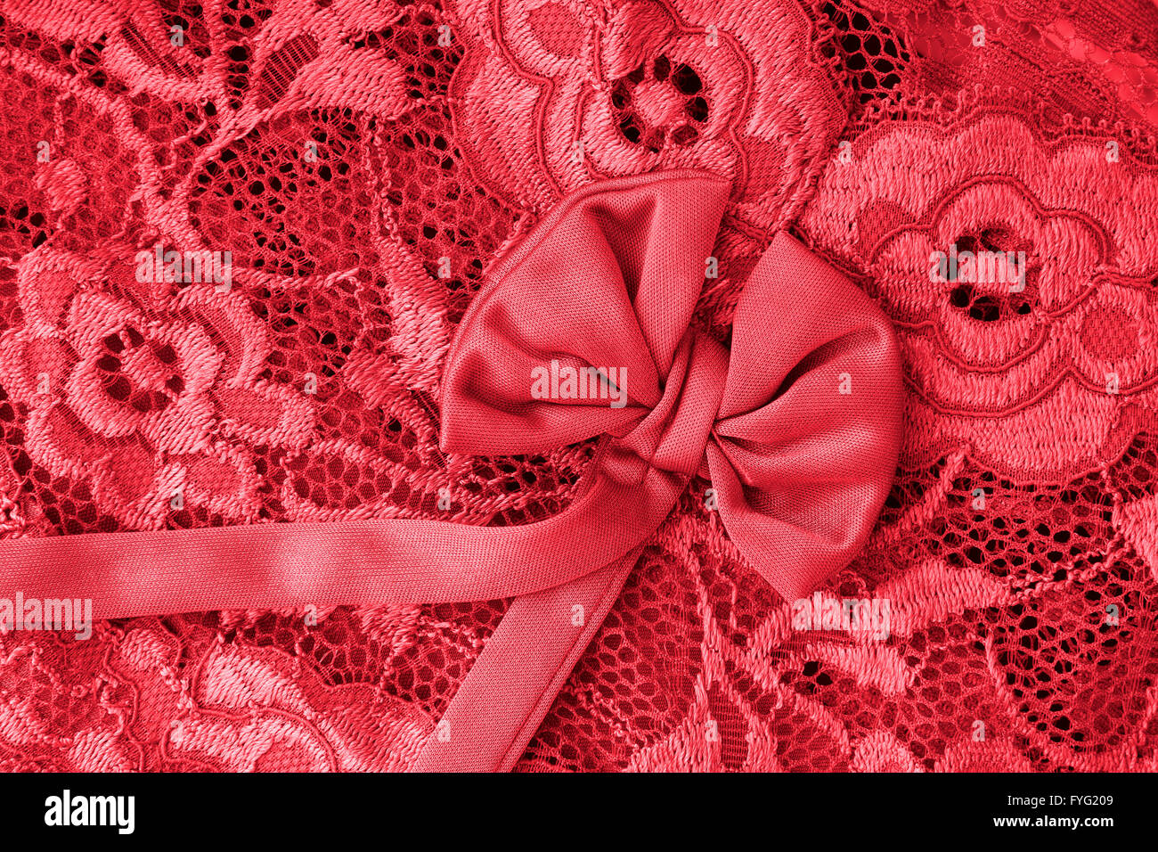 Red lace with bow background. Close up Stock Photo - Alamy