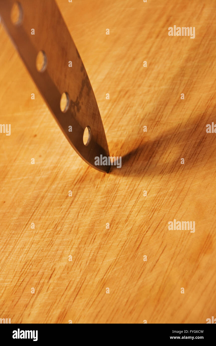 steel knife blade stick into table Stock Photo - Alamy