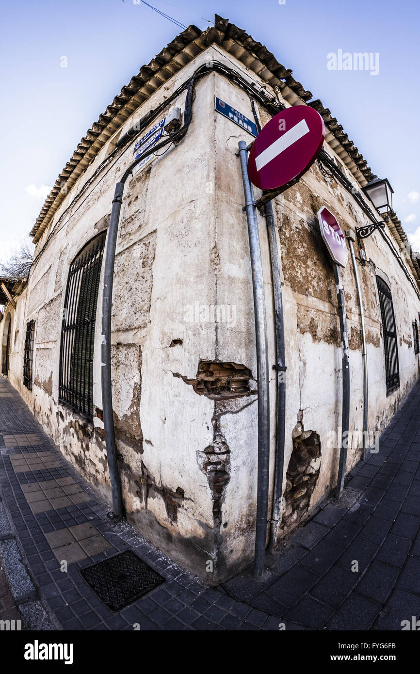 Ruined building corner with stop sign made with 8mm lens Stock Photo ...