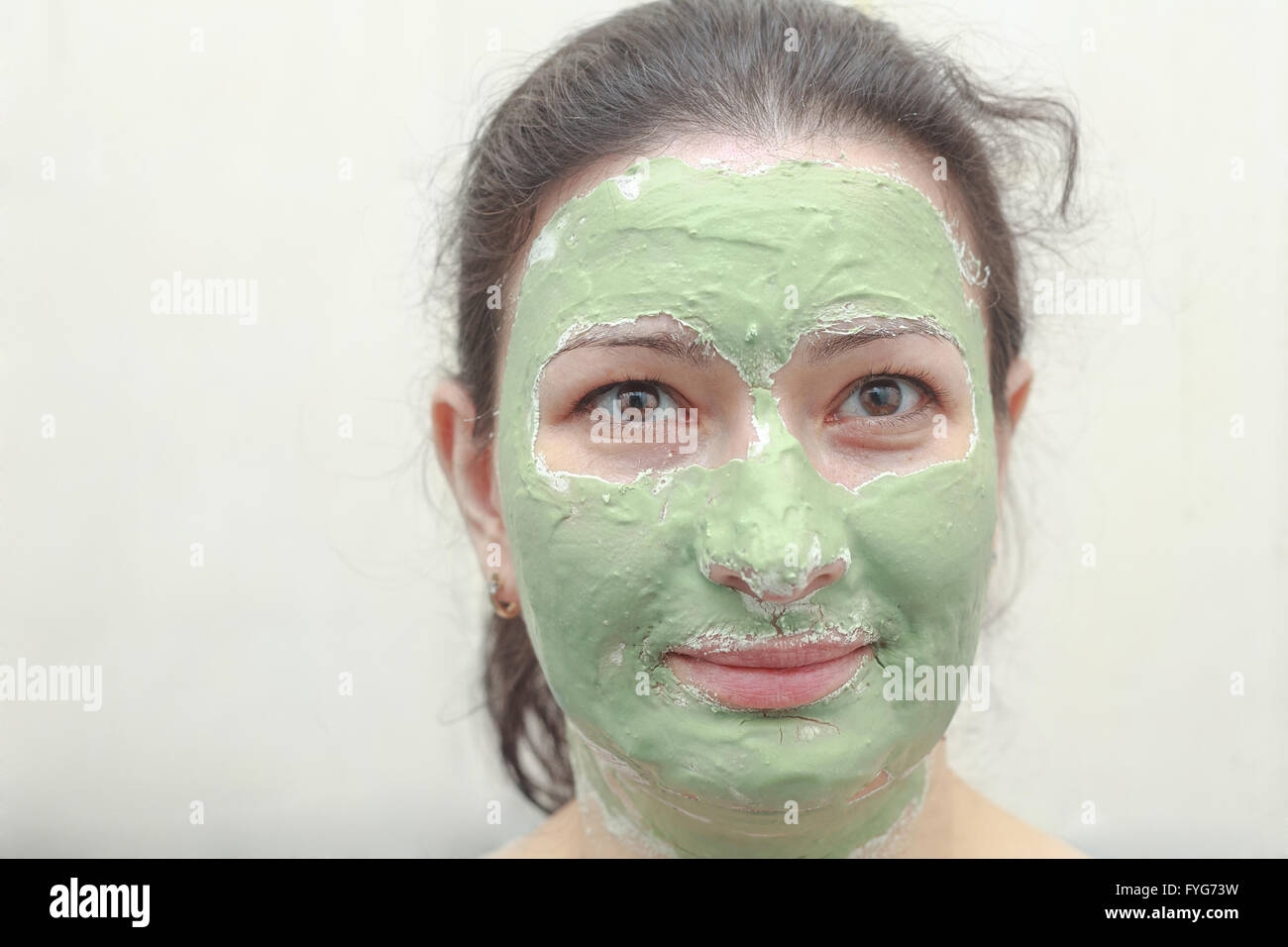 woman with green mask on face healthy treatment Stock Photo - Alamy