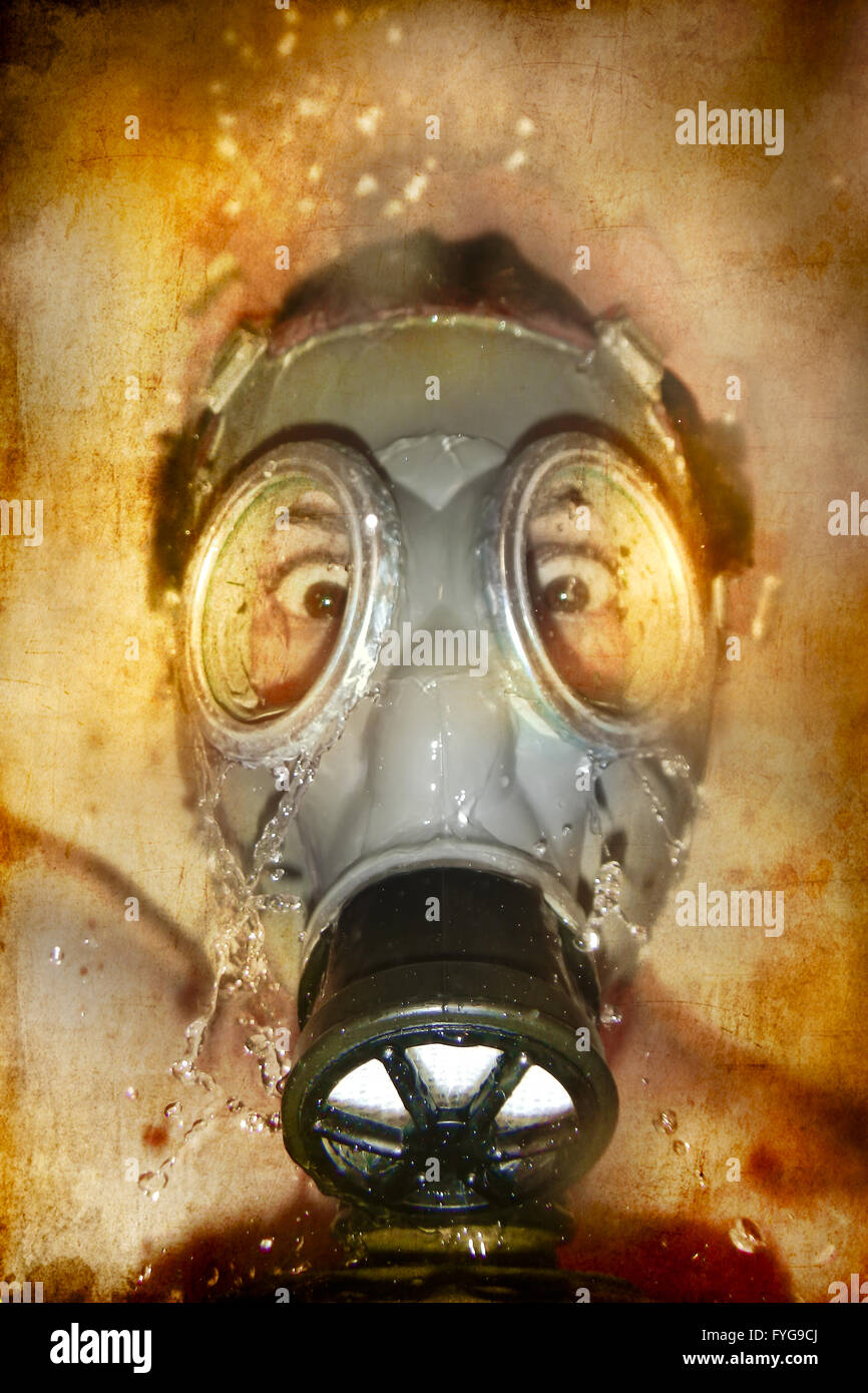 Man in gas mask with water reflection in the eyes over artistic ...
