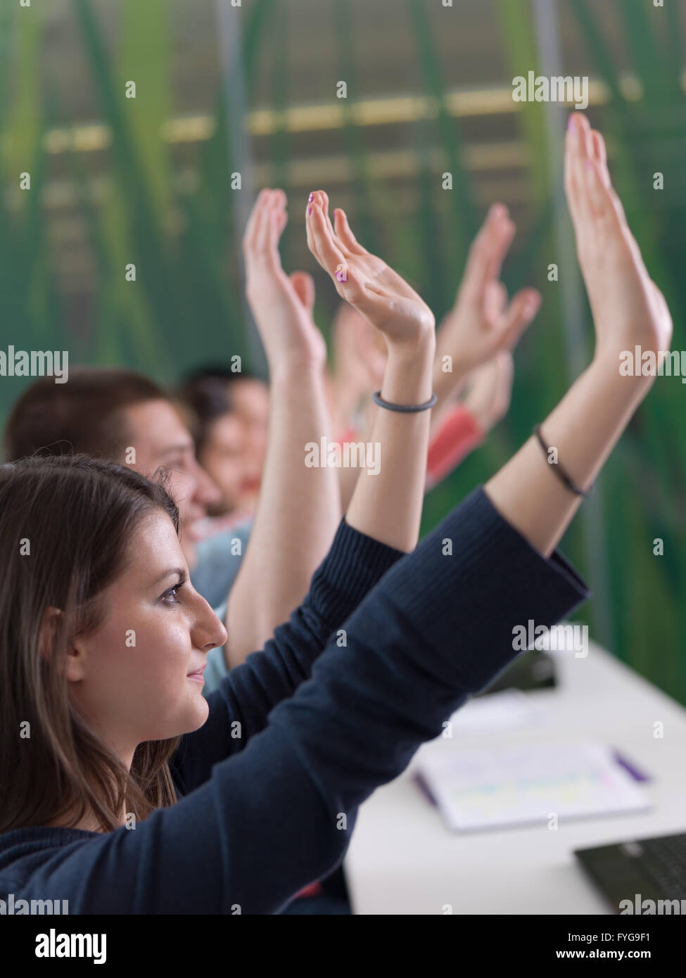 senior teacher teaching lessons, smart students group raise hands up in ...