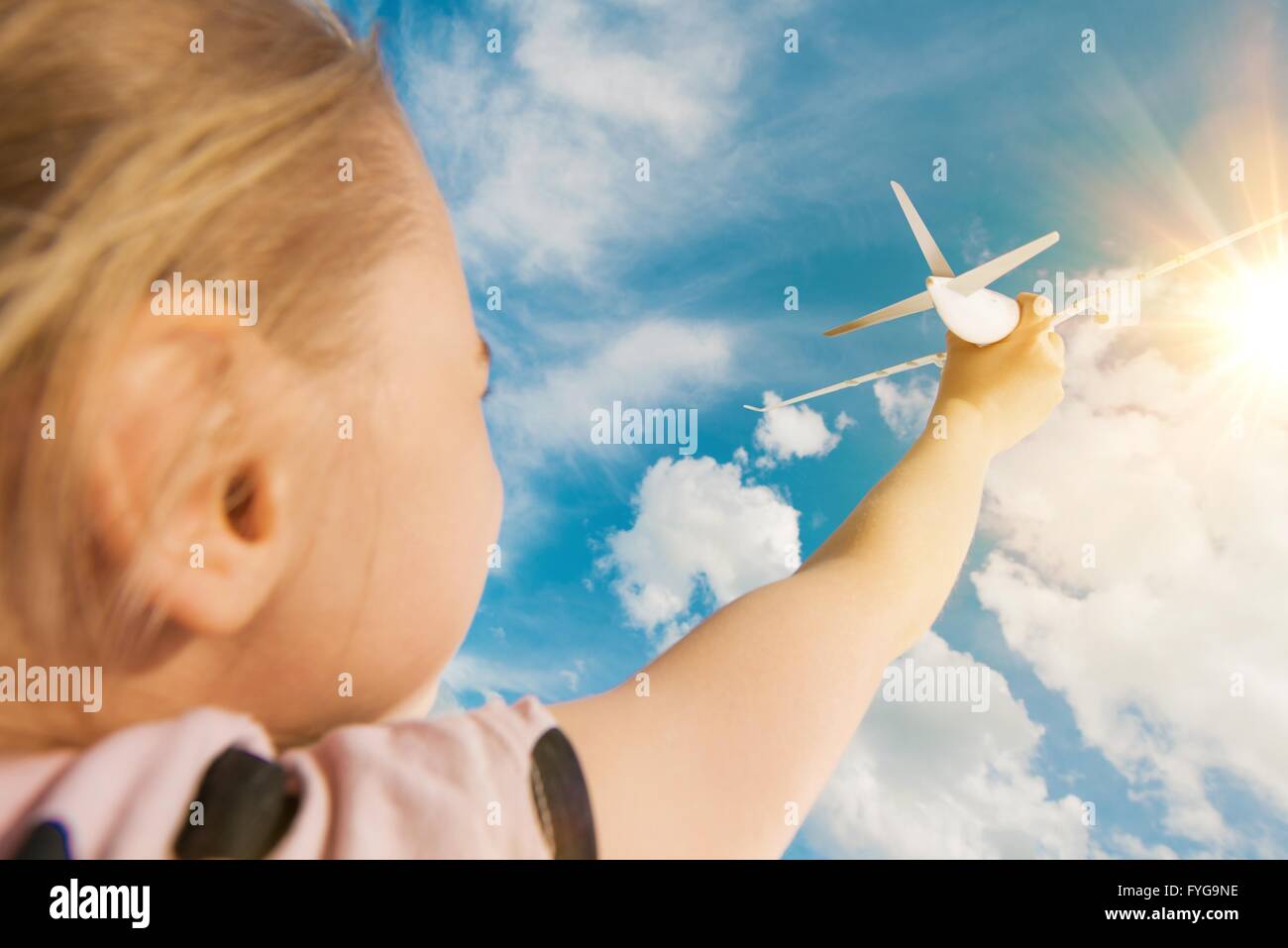 Little Caucasian Girl Dreaming of Fly While Playing with Modern ...