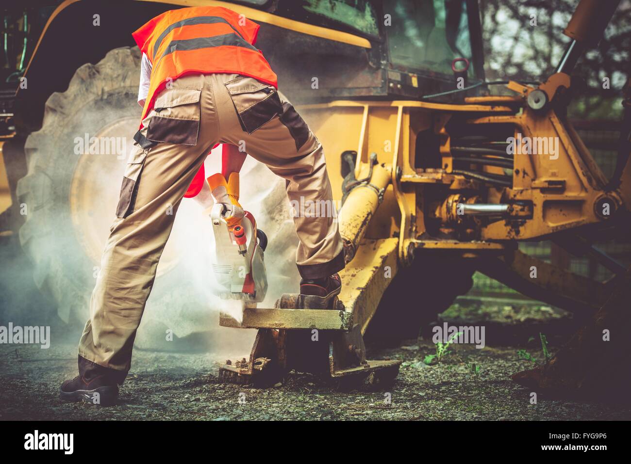 Ambitious Construction Worker Cutting Concrete Elements Using Stone ...