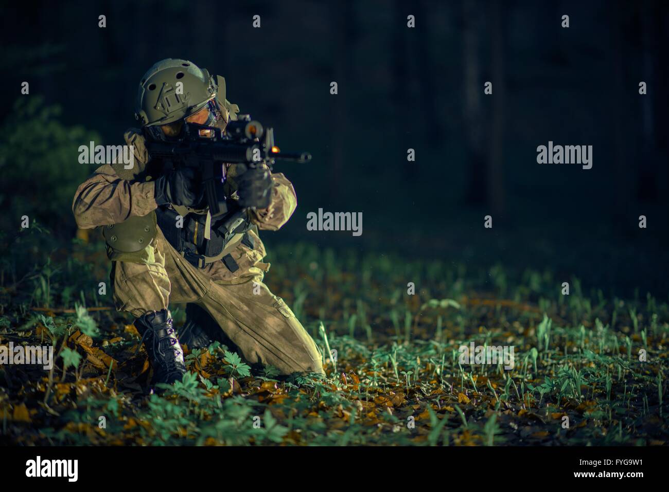 Soldier in Action at Night. Military Operation Concept Stock Photo - Alamy