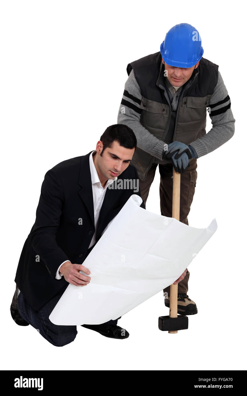 Construction worker working together with an engineer Stock Photo - Alamy