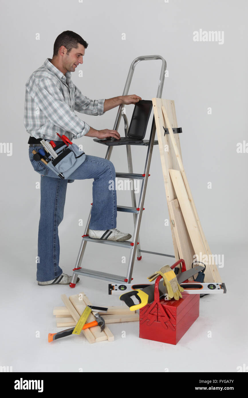 Carpenter using ladder hi-res stock photography and images - Alamy