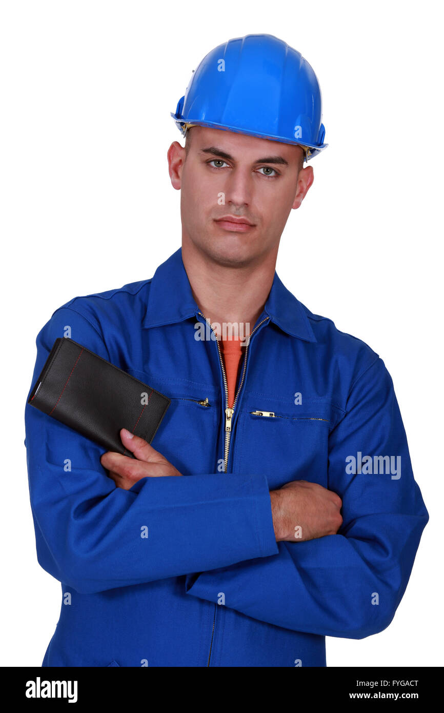 construction worker with folded arms holding wallet Stock Photo - Alamy