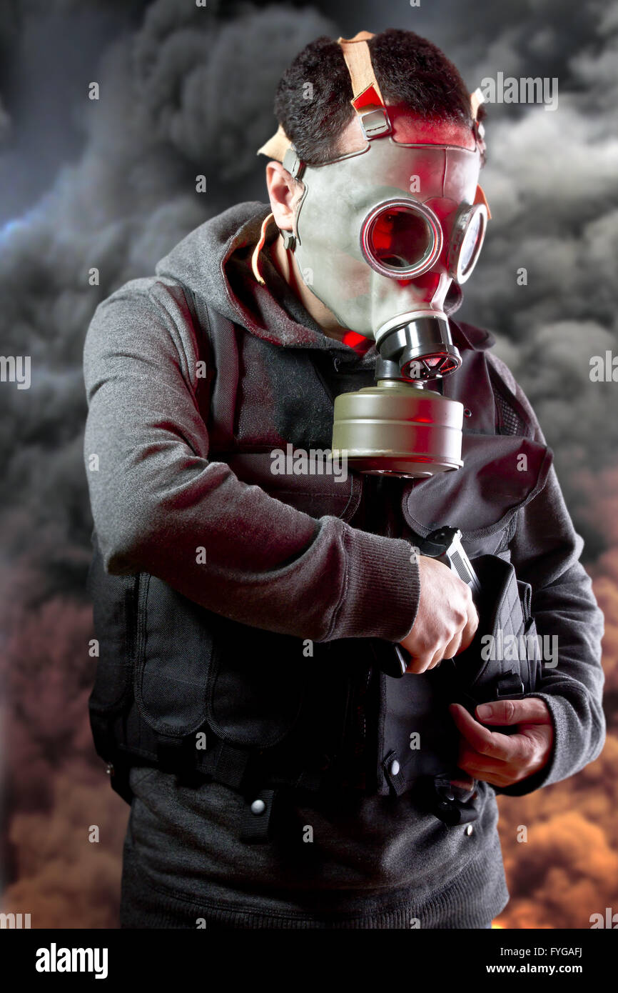 Police man with gas mask over explosion background Stock Photo - Alamy