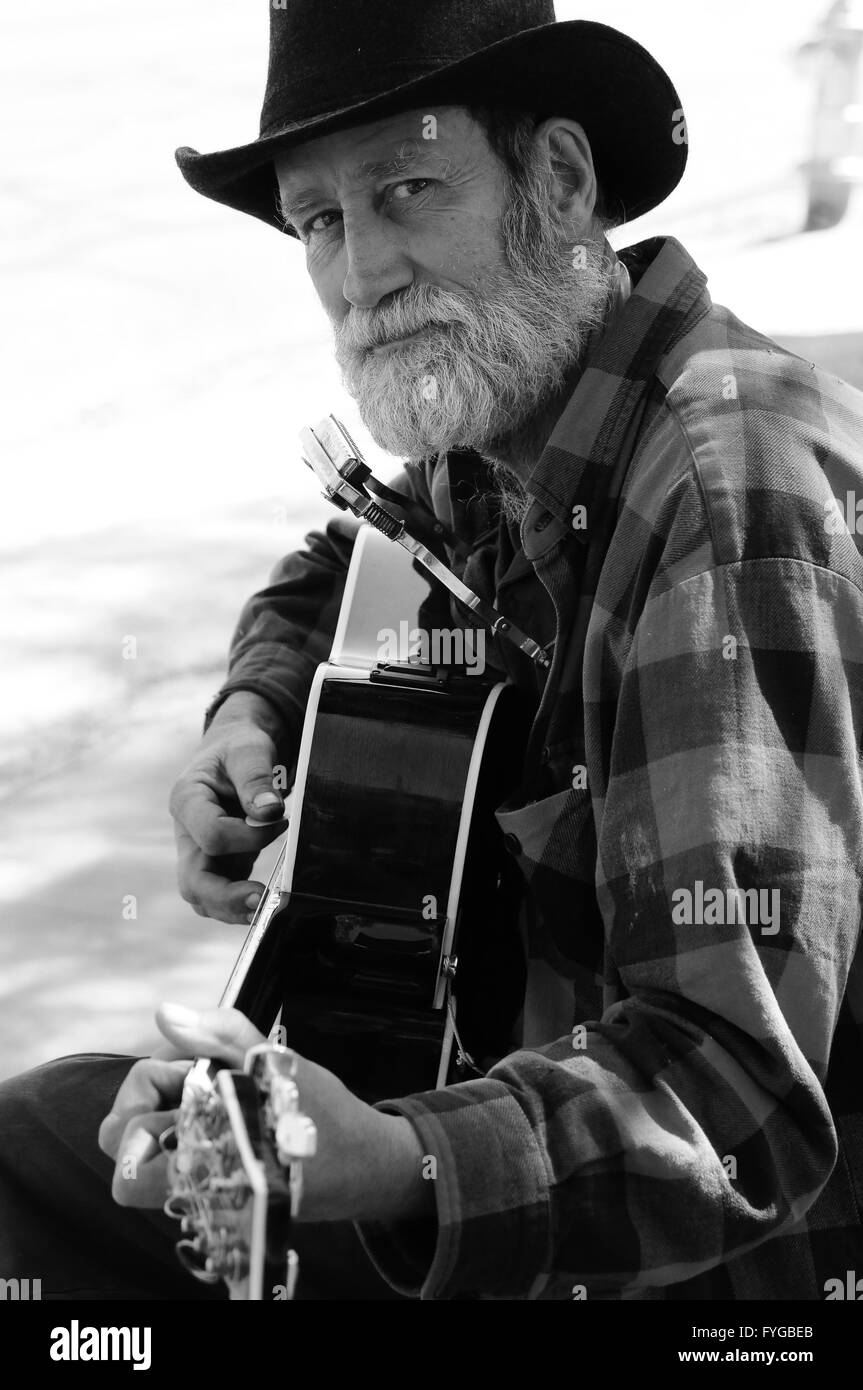 Homeless Man Playing Guitar High Resolution Stock Photography and ...