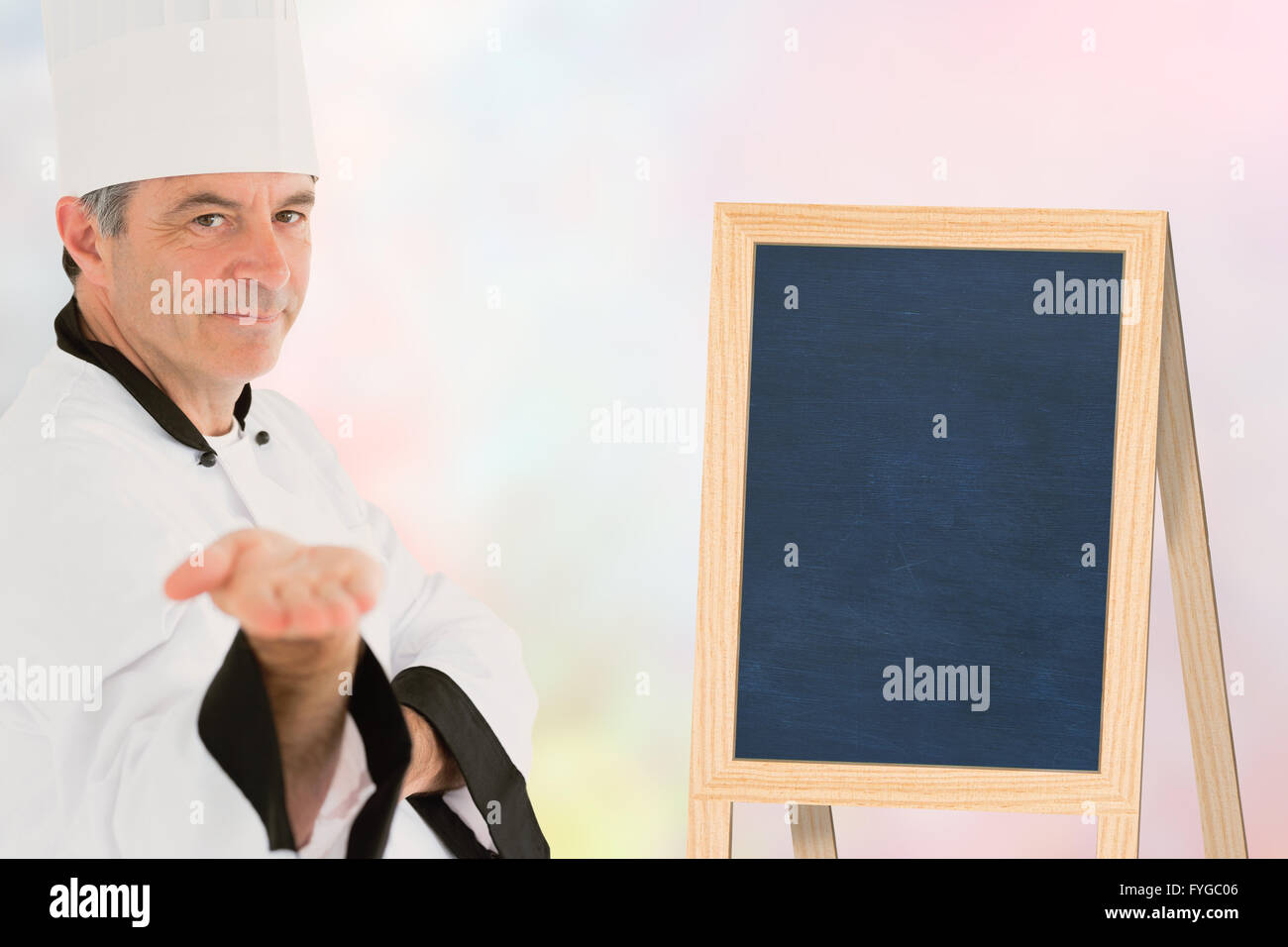 Composite image of male chef presenting an invisible product Stock ...