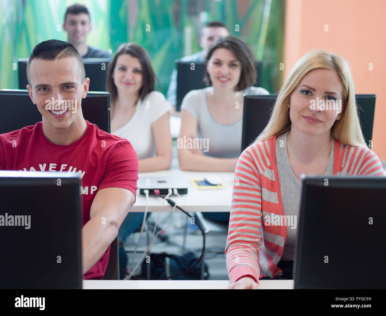 technology students group in computer lab school classroom working on ...