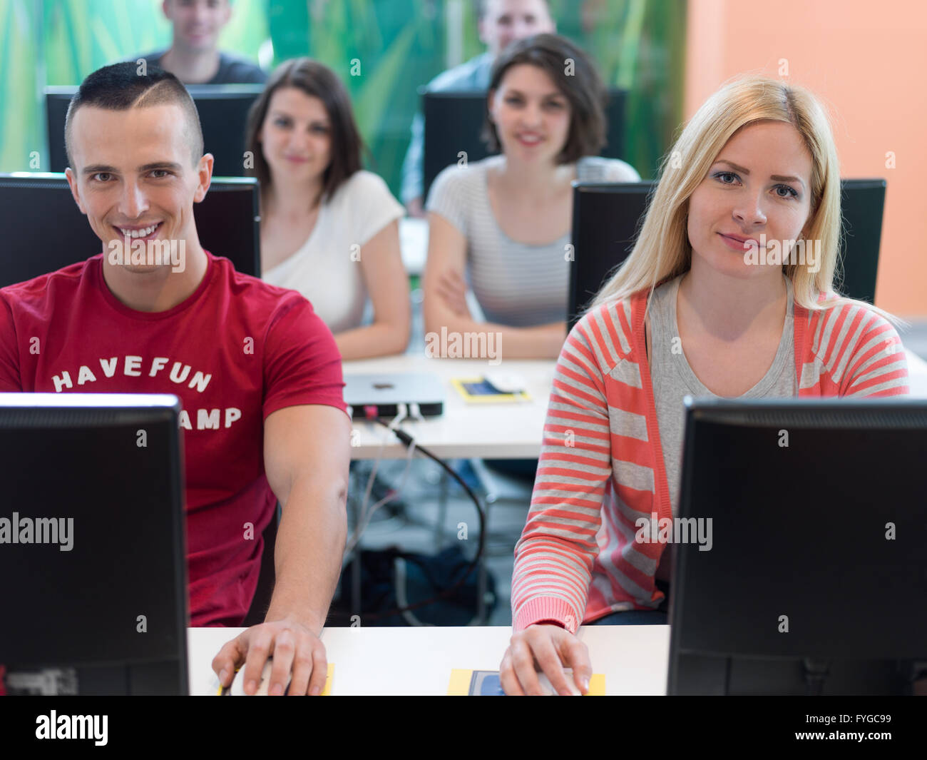 technology students group in computer lab school classroom working on ...