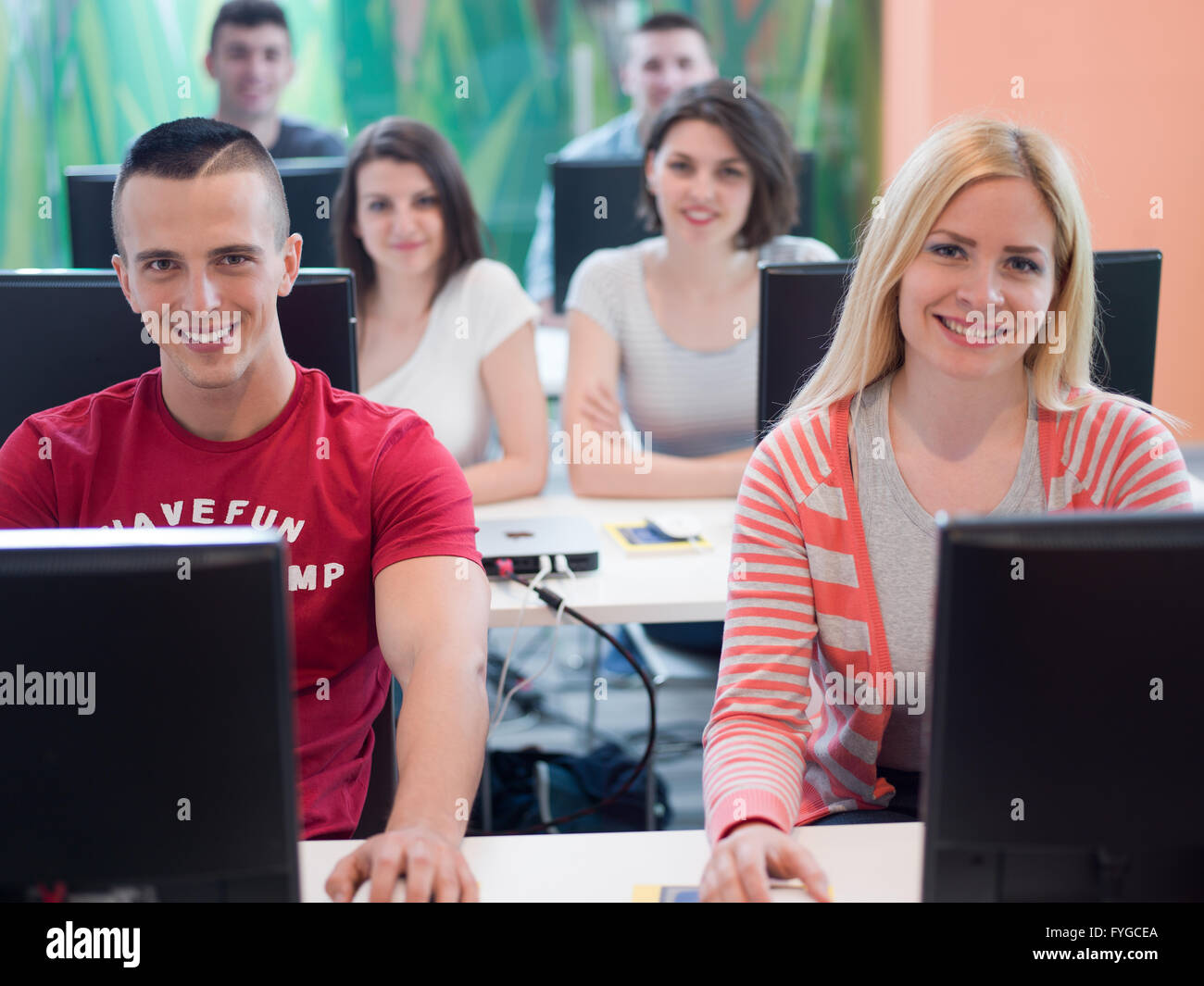 technology students group in computer lab school classroom working on ...