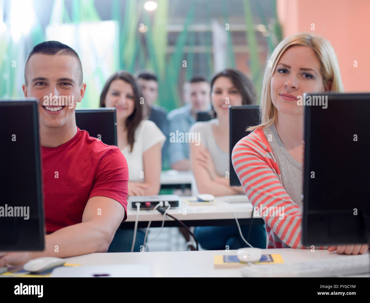 technology students group in computer lab school classroom working on ...