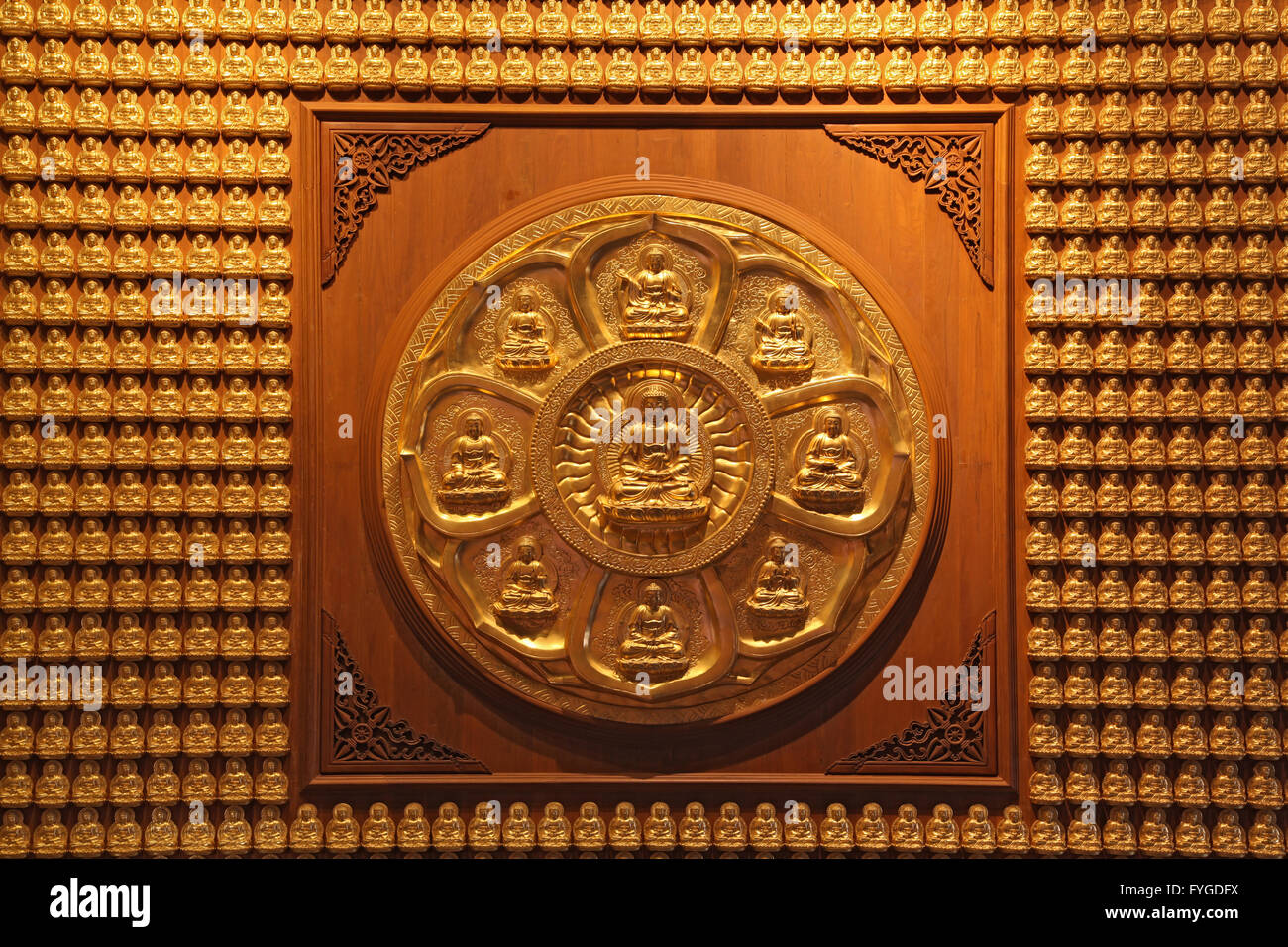 golden wheel of buddha on wall in dragon temple Thailand Stock Photo ...