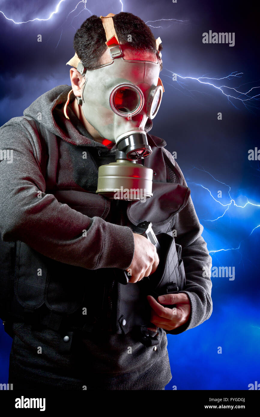 Man with long leather jacket and assault rifle over storm background ...