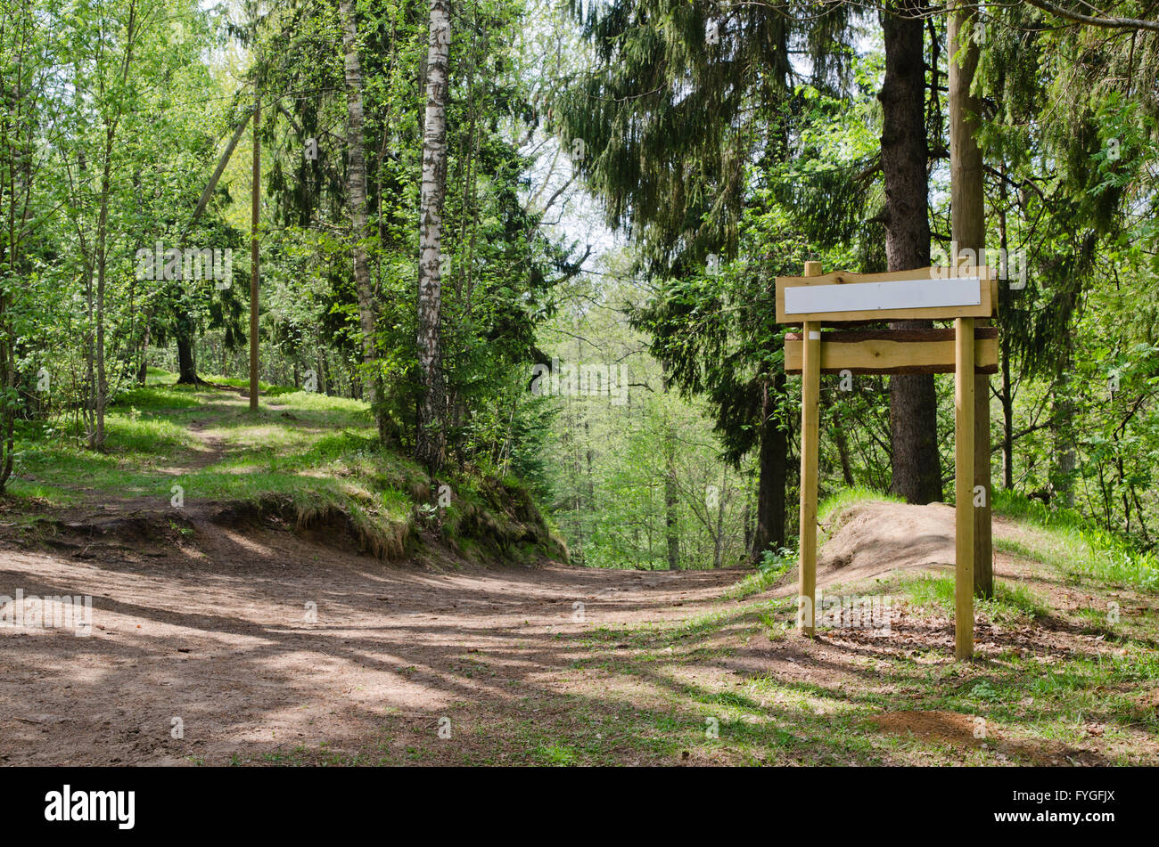Wooden sign board on the natural trail. In the forest park Stock Photo ...