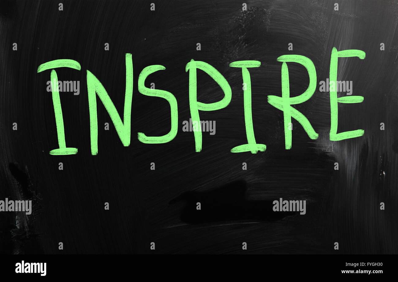 Inspire handwritten with white chalk on a blackboard Stock Photo - Alamy