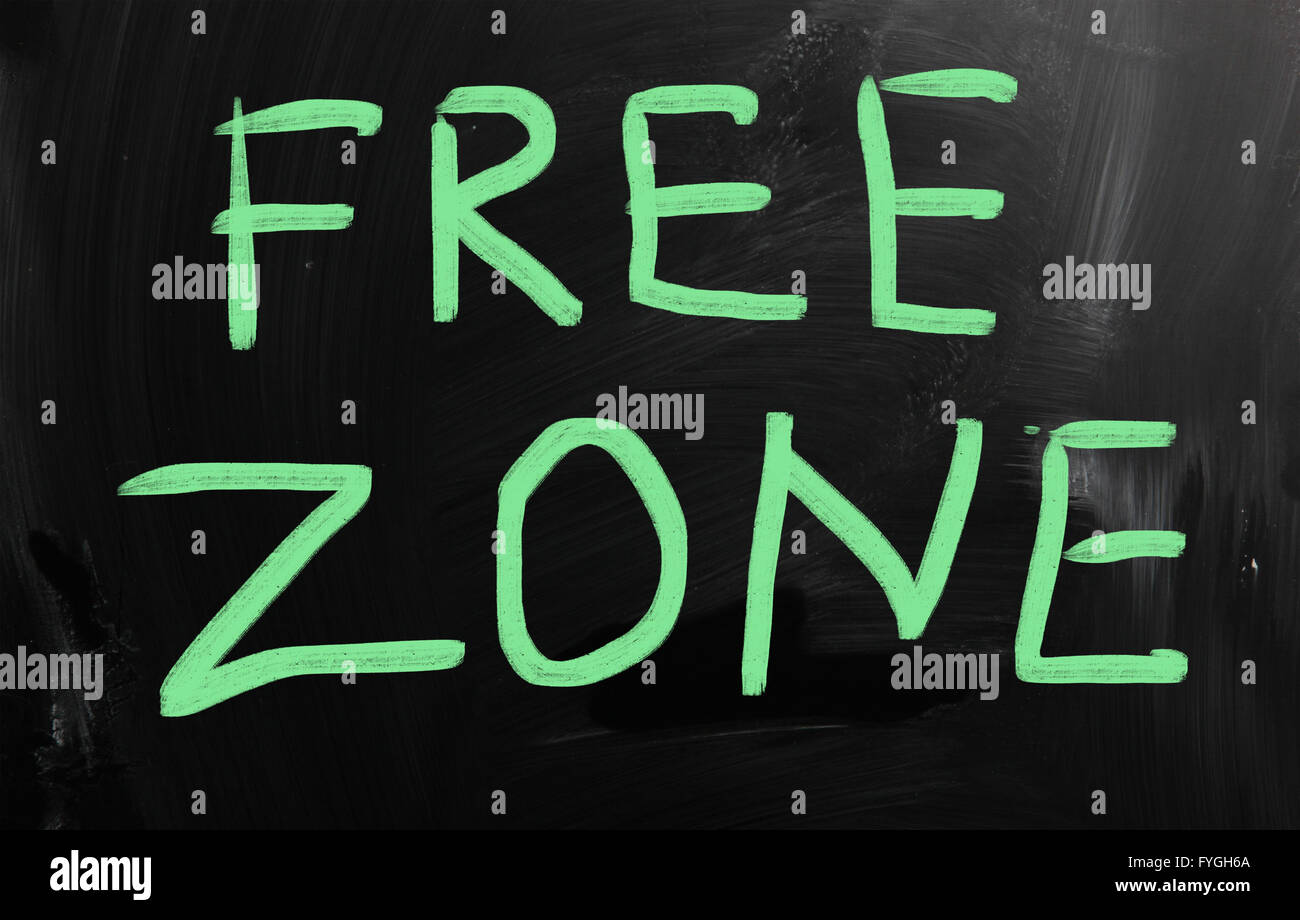 Free zone handwritten with white chalk on a blackboard Stock Photo - Alamy