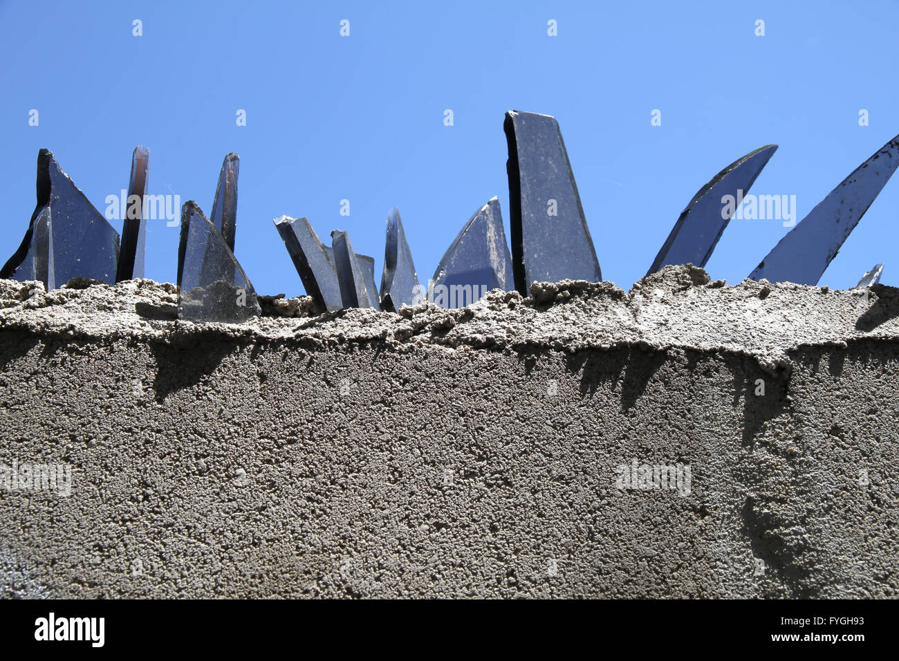 Wall with glass fragments Stock Photo - Alamy