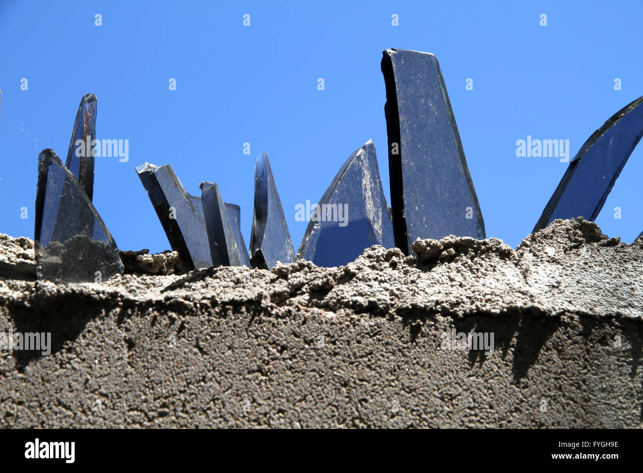 Wall with glass fragments Stock Photo - Alamy