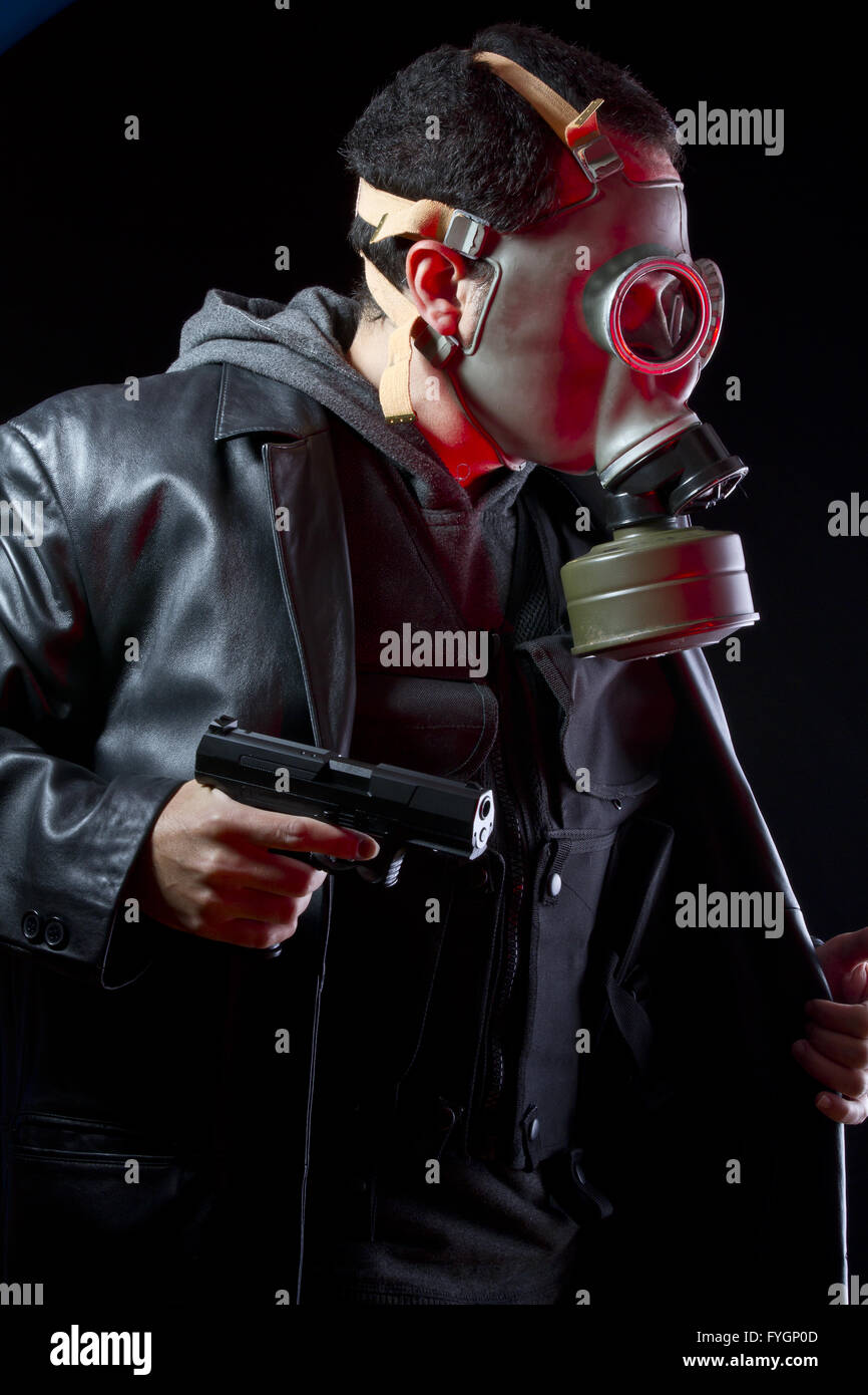 Armed man with gas mask and gun Stock Photo - Alamy