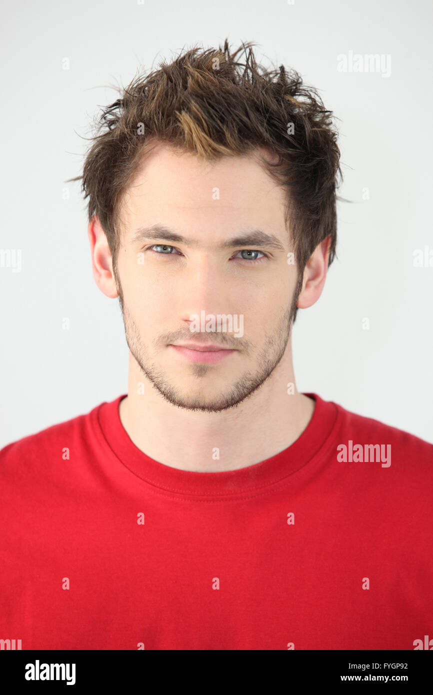 head-and-shoulders portrait of young man with neutral expression Stock ...