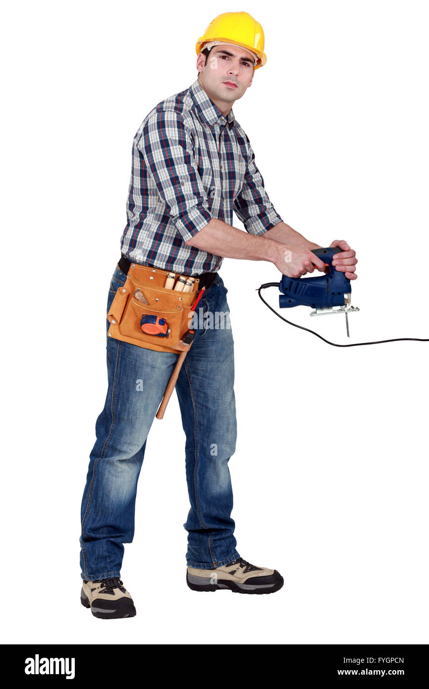 full-length shot of young carpenter using sander machine Stock Photo ...