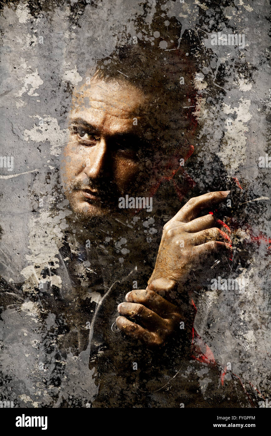 Portrait of gangster over dirty wall Stock Photo - Alamy