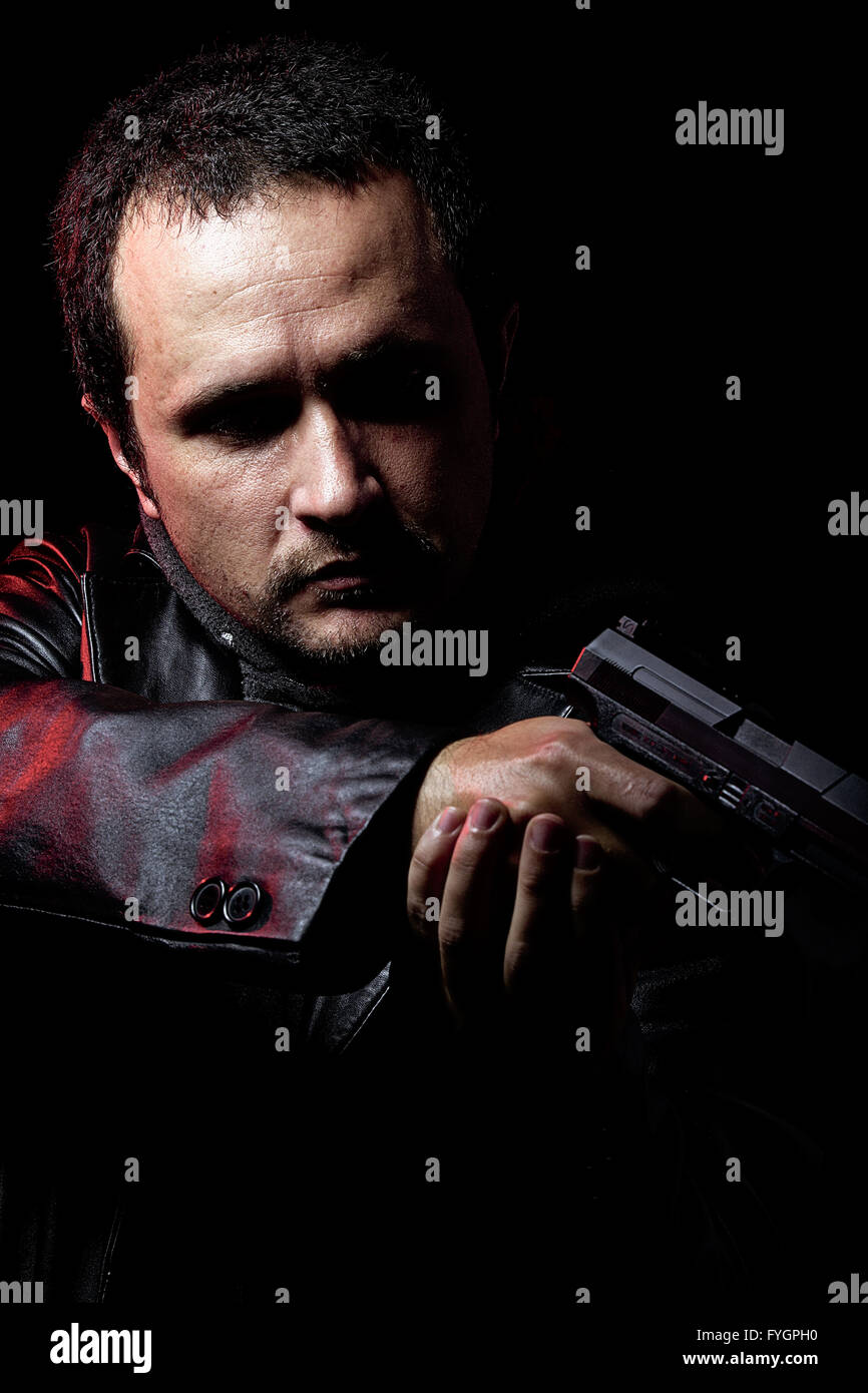 Man with gun Stock Photo - Alamy