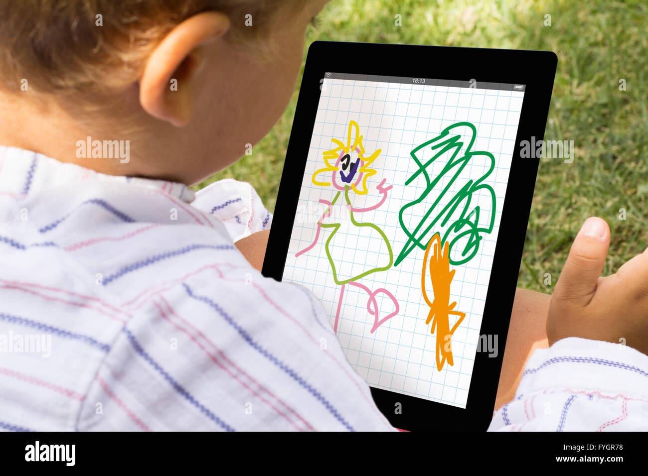 Kid drawing with tablet app Stock Photo - Alamy