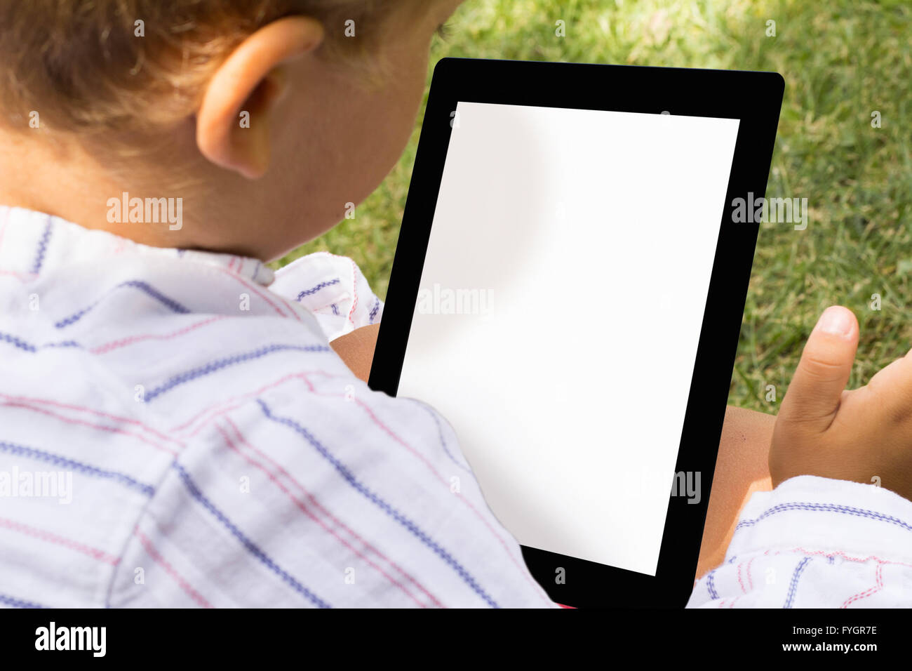 Kid with tablet Stock Photo - Alamy