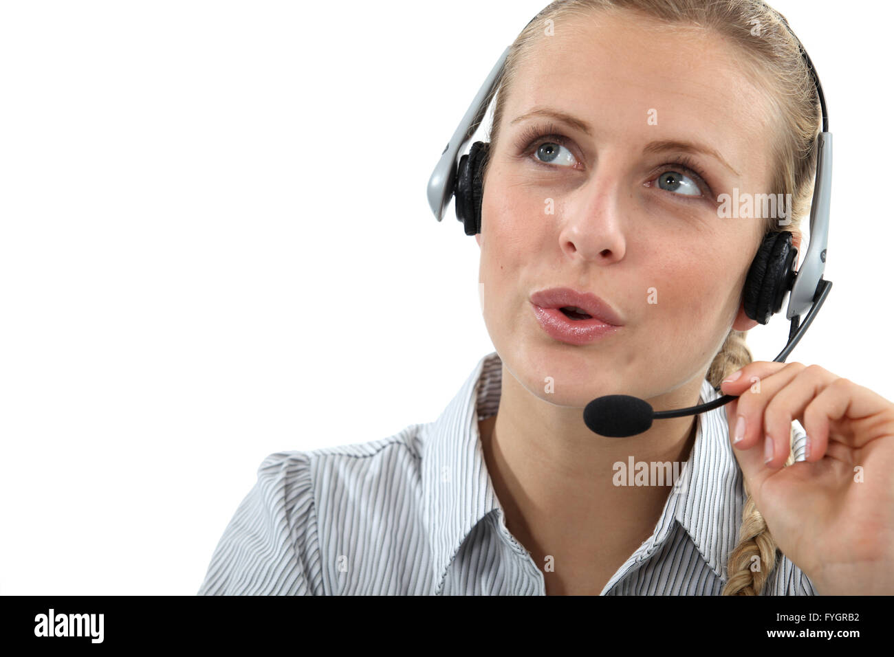 Blond call center worker helping customer over the phone Stock Photo ...