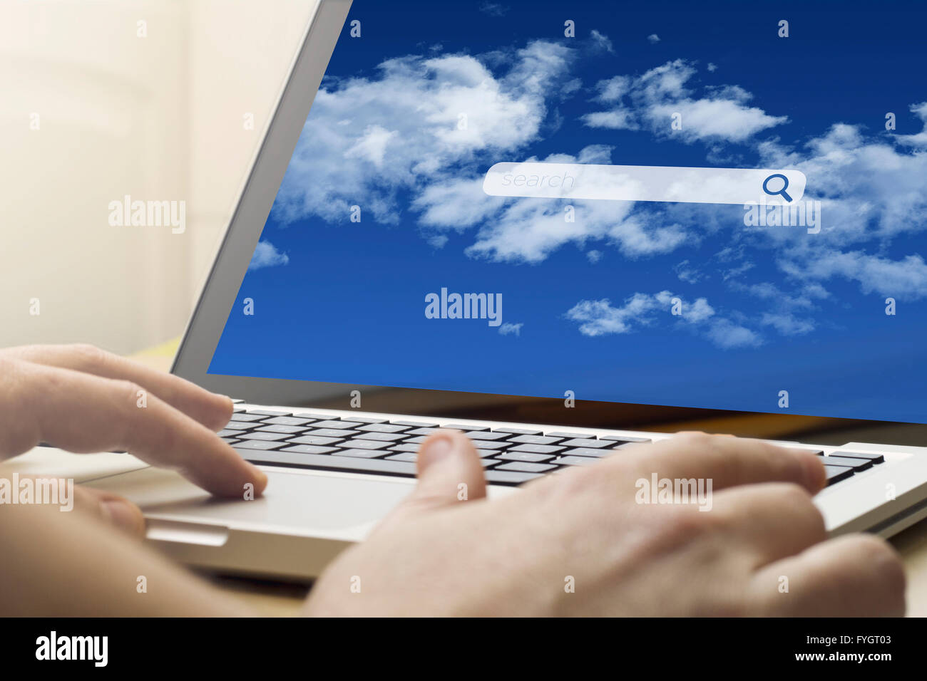 search concept: man using a laptop with online search application on ...