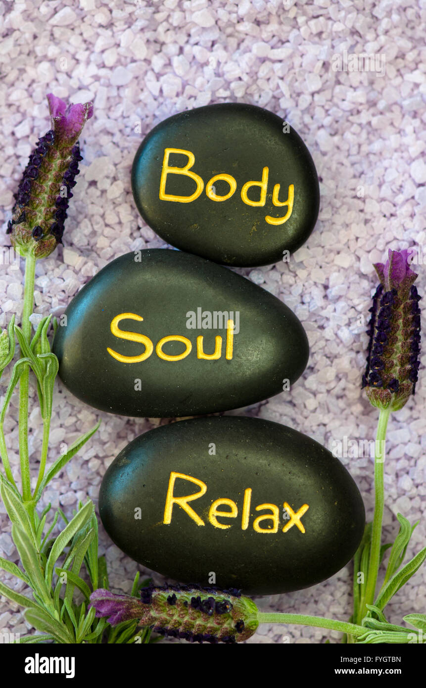 black lava stone with words body, soul, relax Stock Photo - Alamy