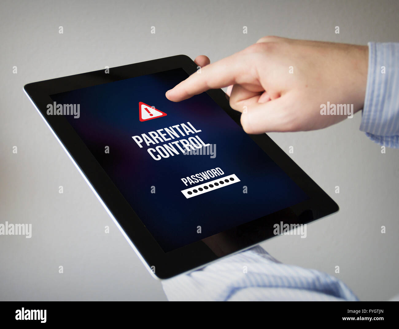 new technologies concept: hands with touchscreen tablet with parental ...