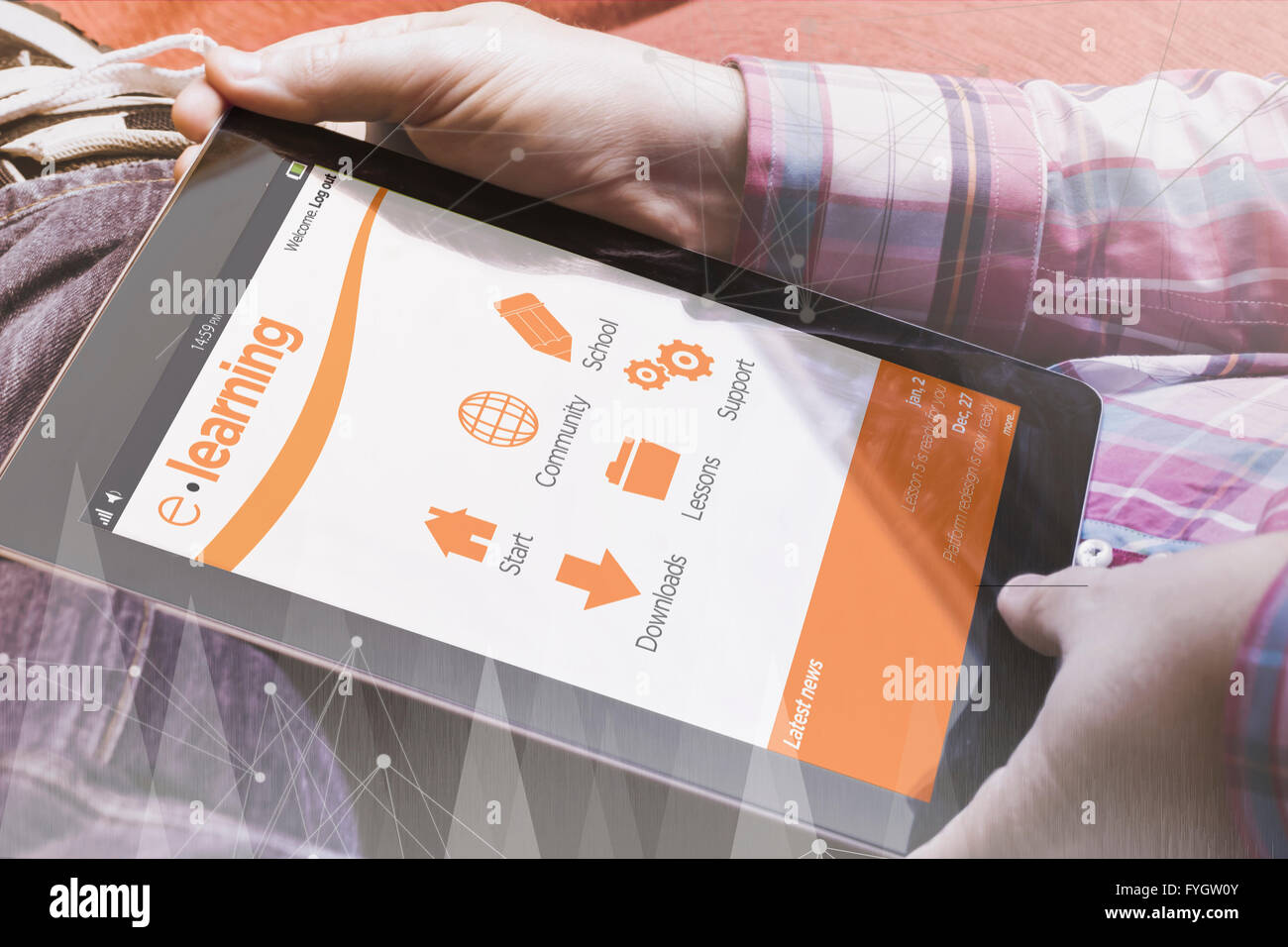 close-up view of man holding a tablet showing elearning online site. E ...