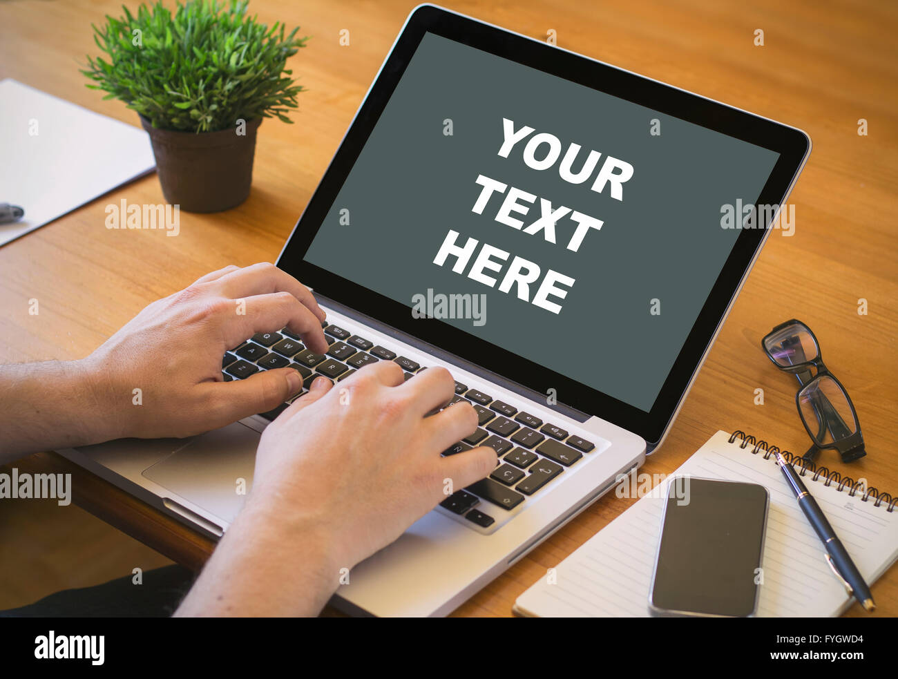 Close-up top view of a coolhunter working on laptop. all screen ...